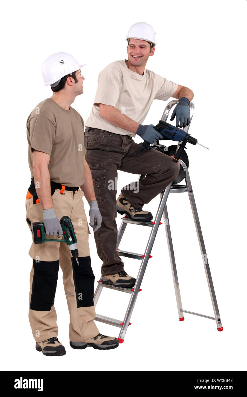 Two handymen at work Stock Photo - Alamy