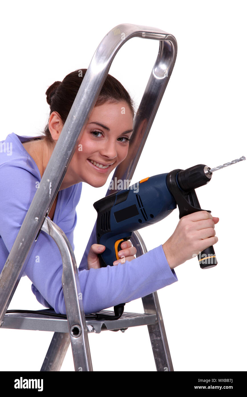 Woman with drill Stock Photo - Alamy