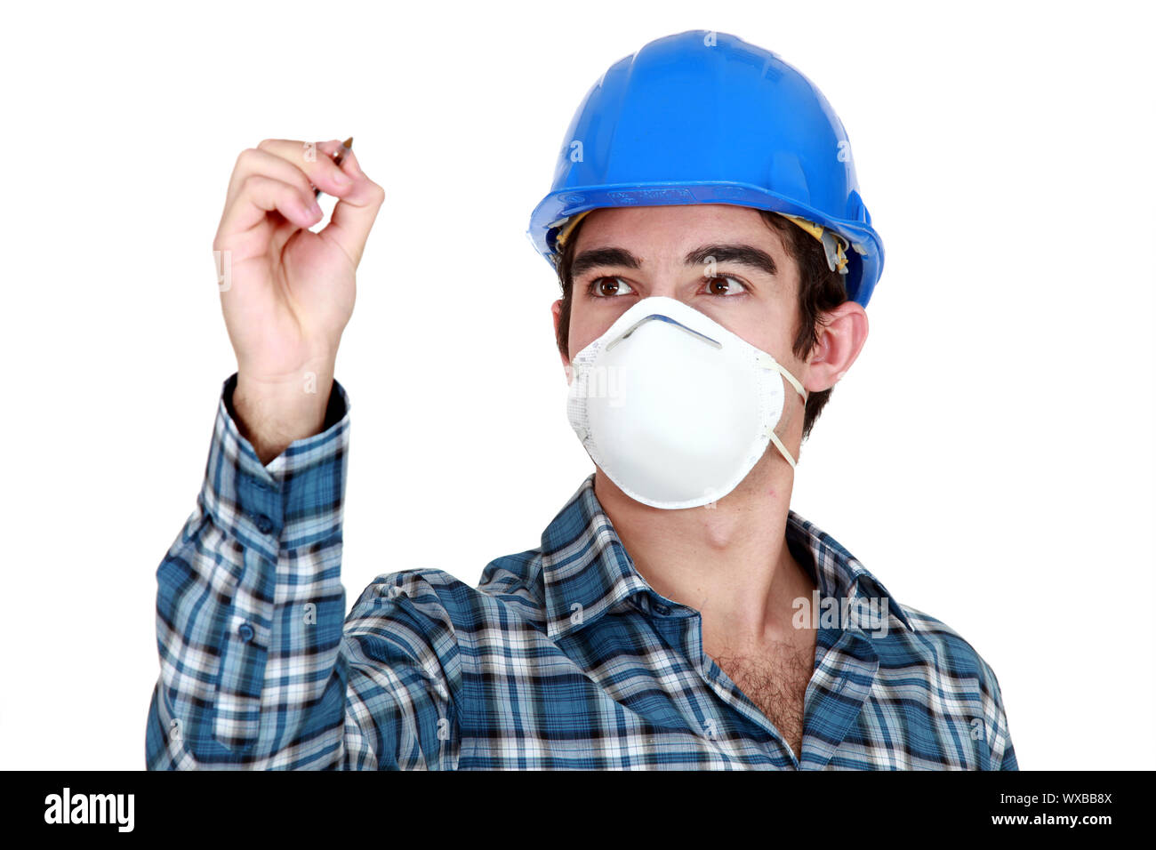 Young builder wearing a mask Stock Photo - Alamy
