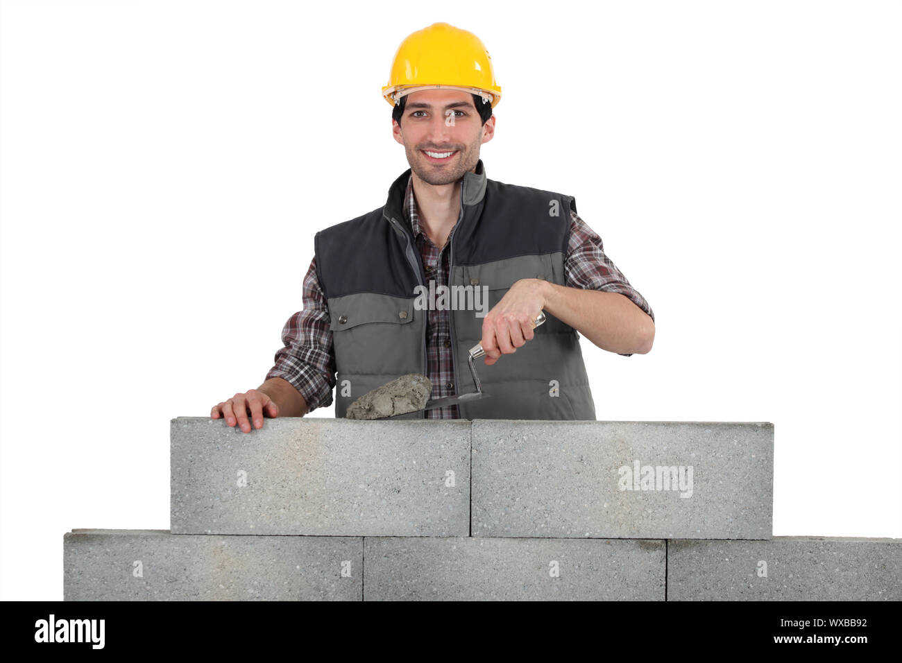 Bricklayer building a wall Stock Photo - Alamy