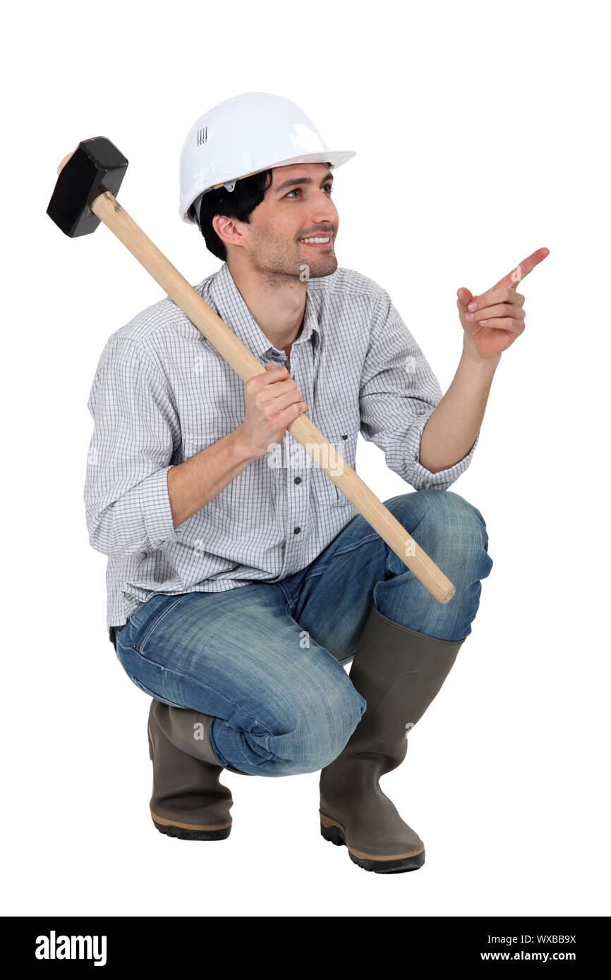 Worker with big hammer Stock Photo - Alamy