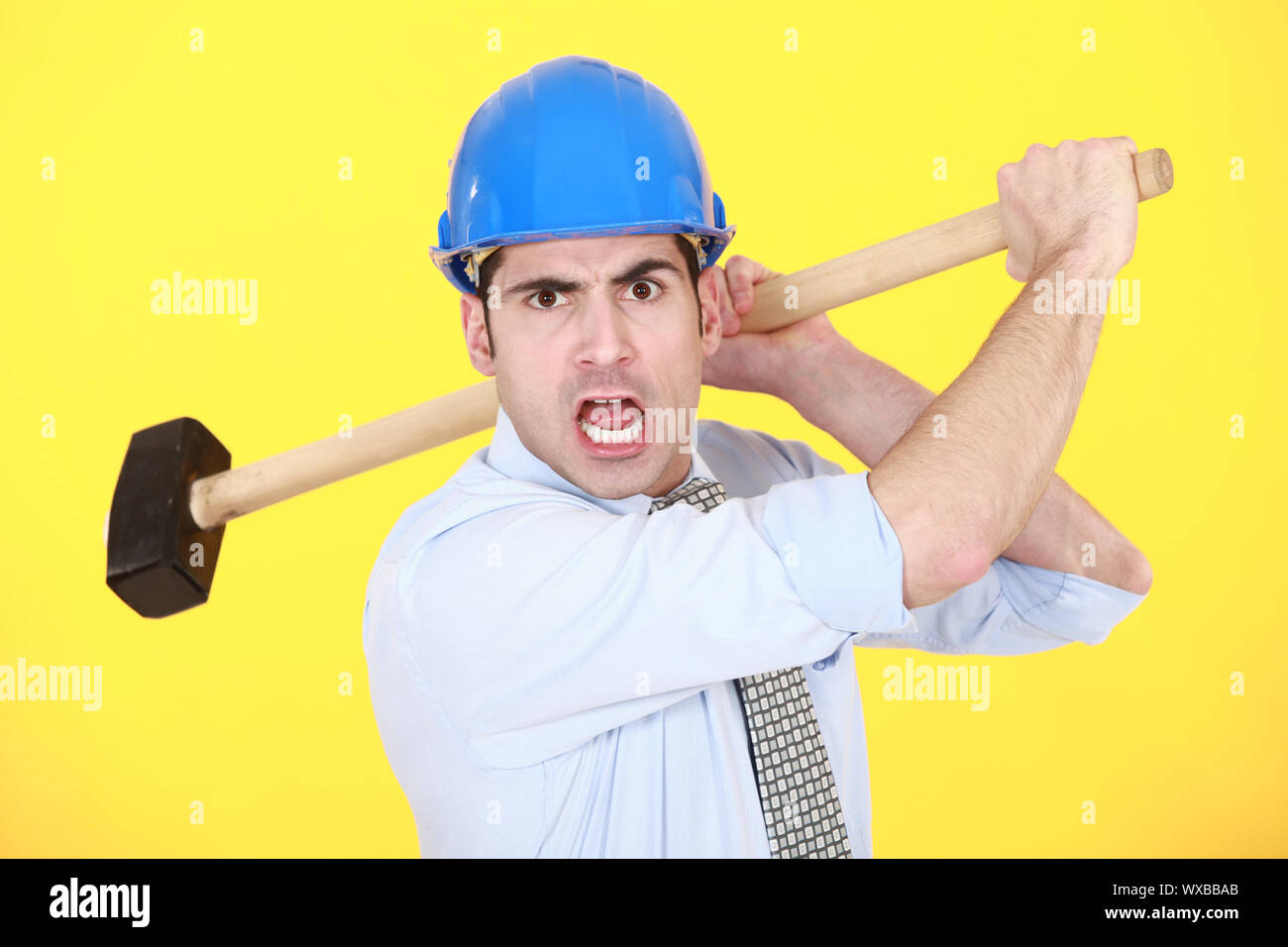 Angry man with hammer Stock Photo - Alamy