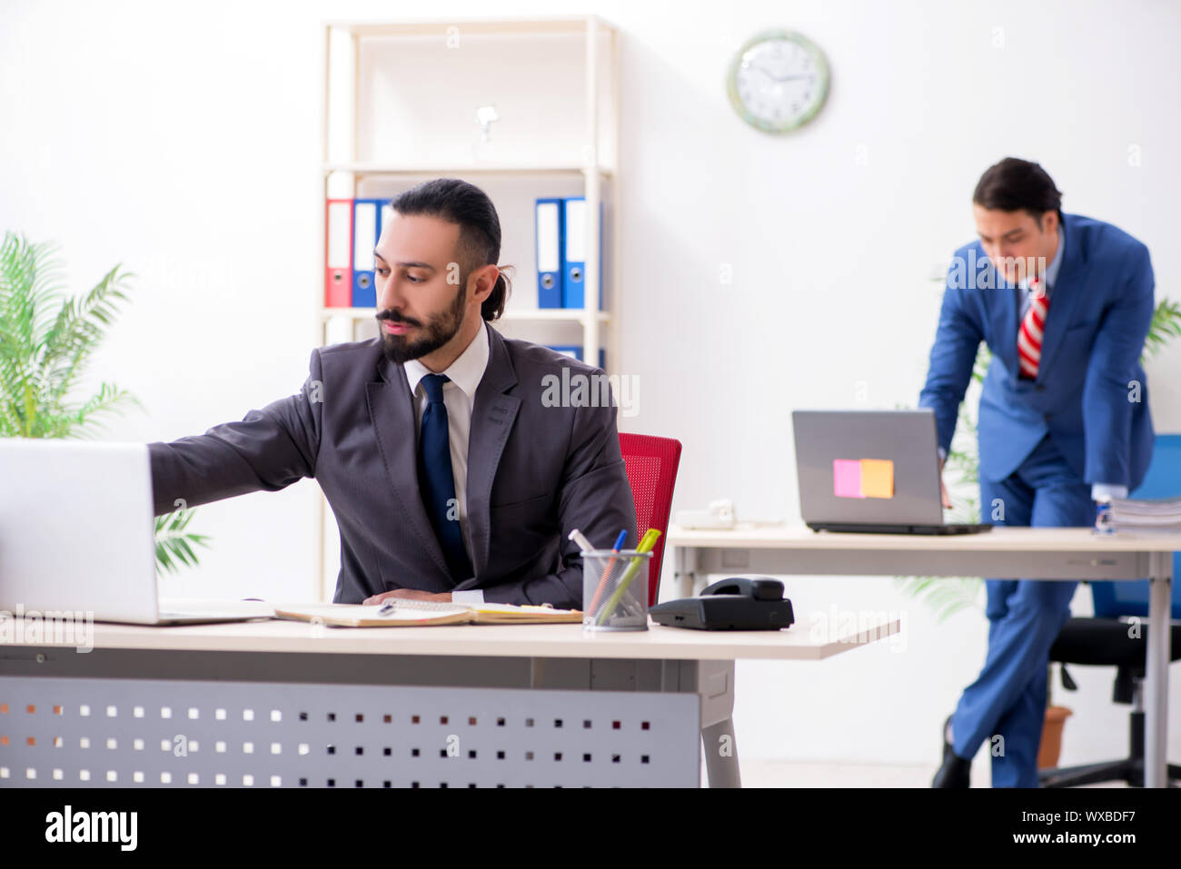 Two male colleagues in the office Stock Photo - Alamy