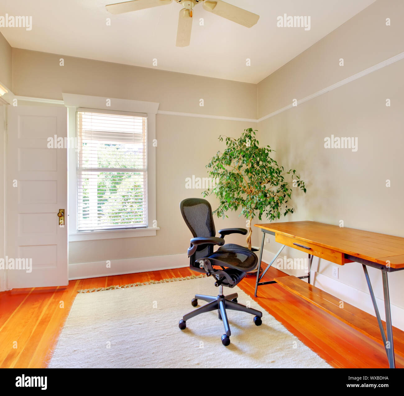Home office room interior with desk and beige walls Stock Photo - Alamy
