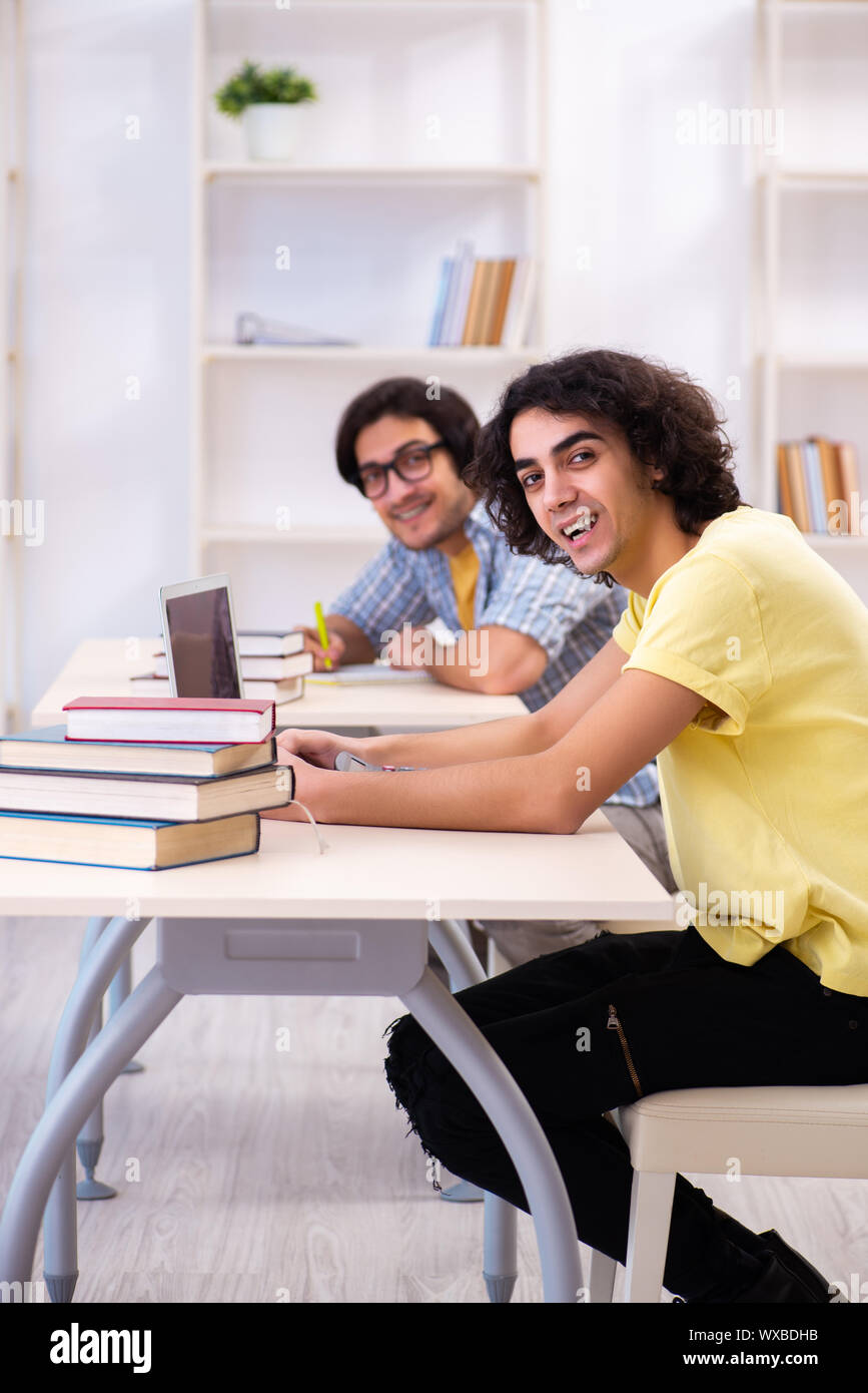 Two male students in the classroom Stock Photo - Alamy