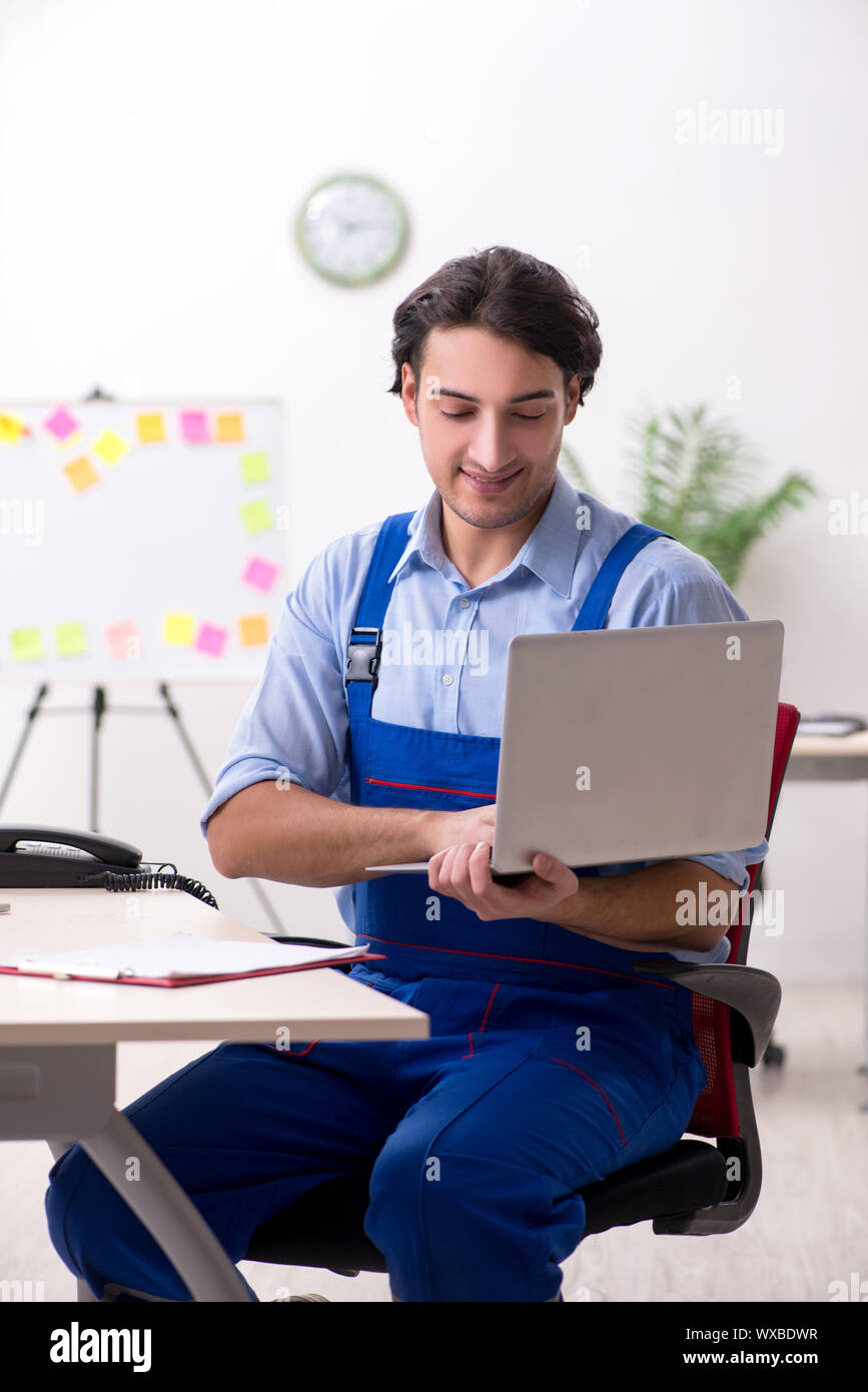 Male it specialist working in the office Stock Photo - Alamy