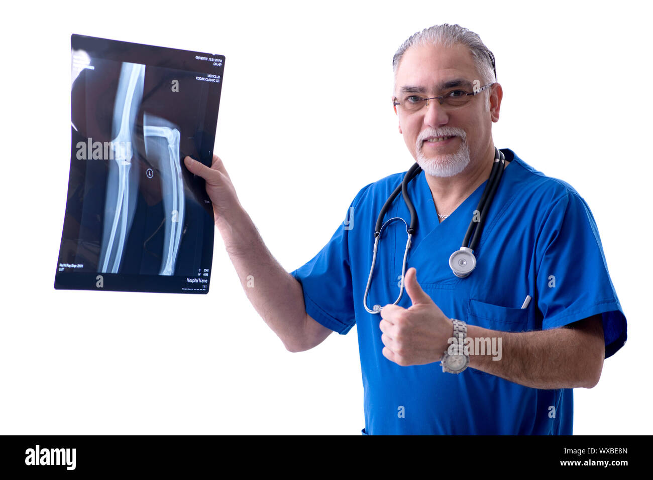 White bearded old doctor radiologist working in clinic Stock Photo - Alamy