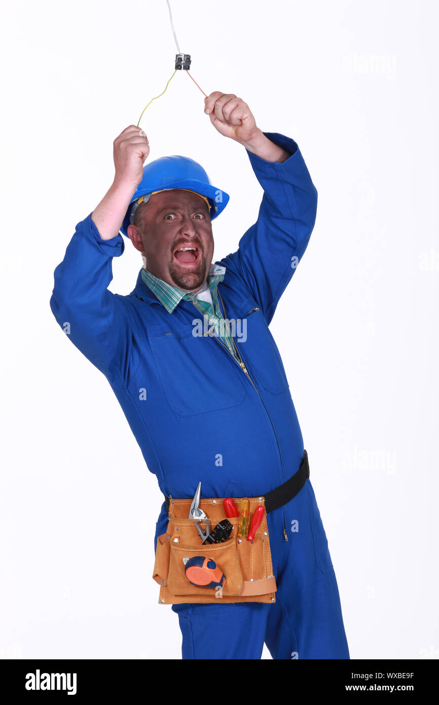 Electrician getting a shock Stock Photo - Alamy