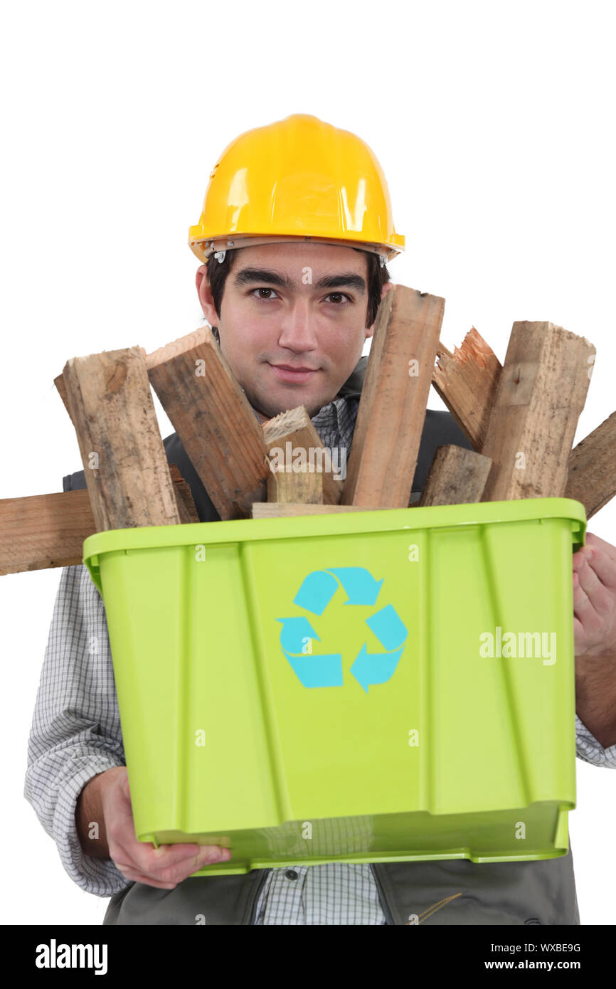 Worker recycling wood Stock Photo - Alamy