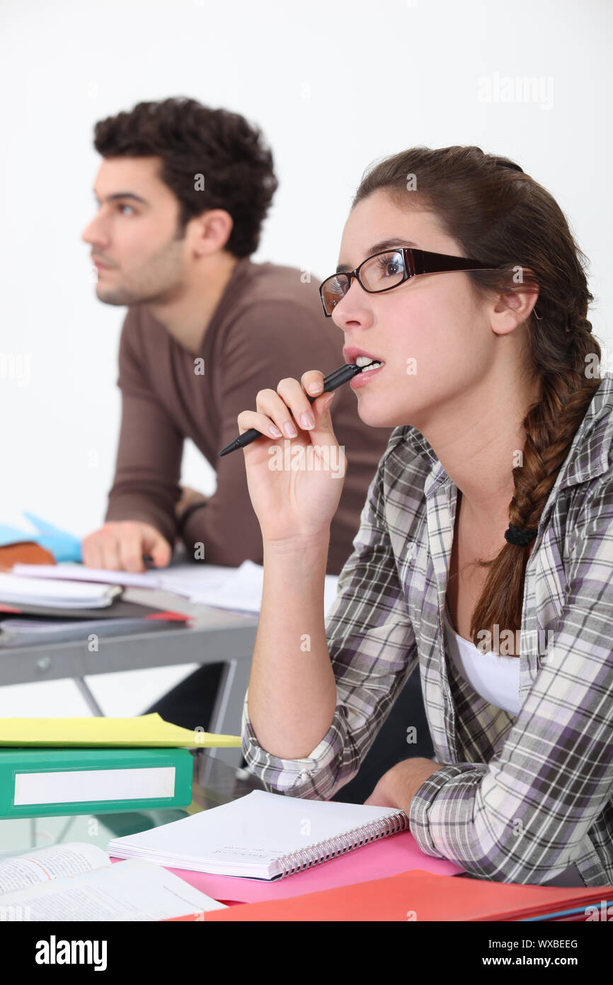 Two students concentrating in class Stock Photo - Alamy