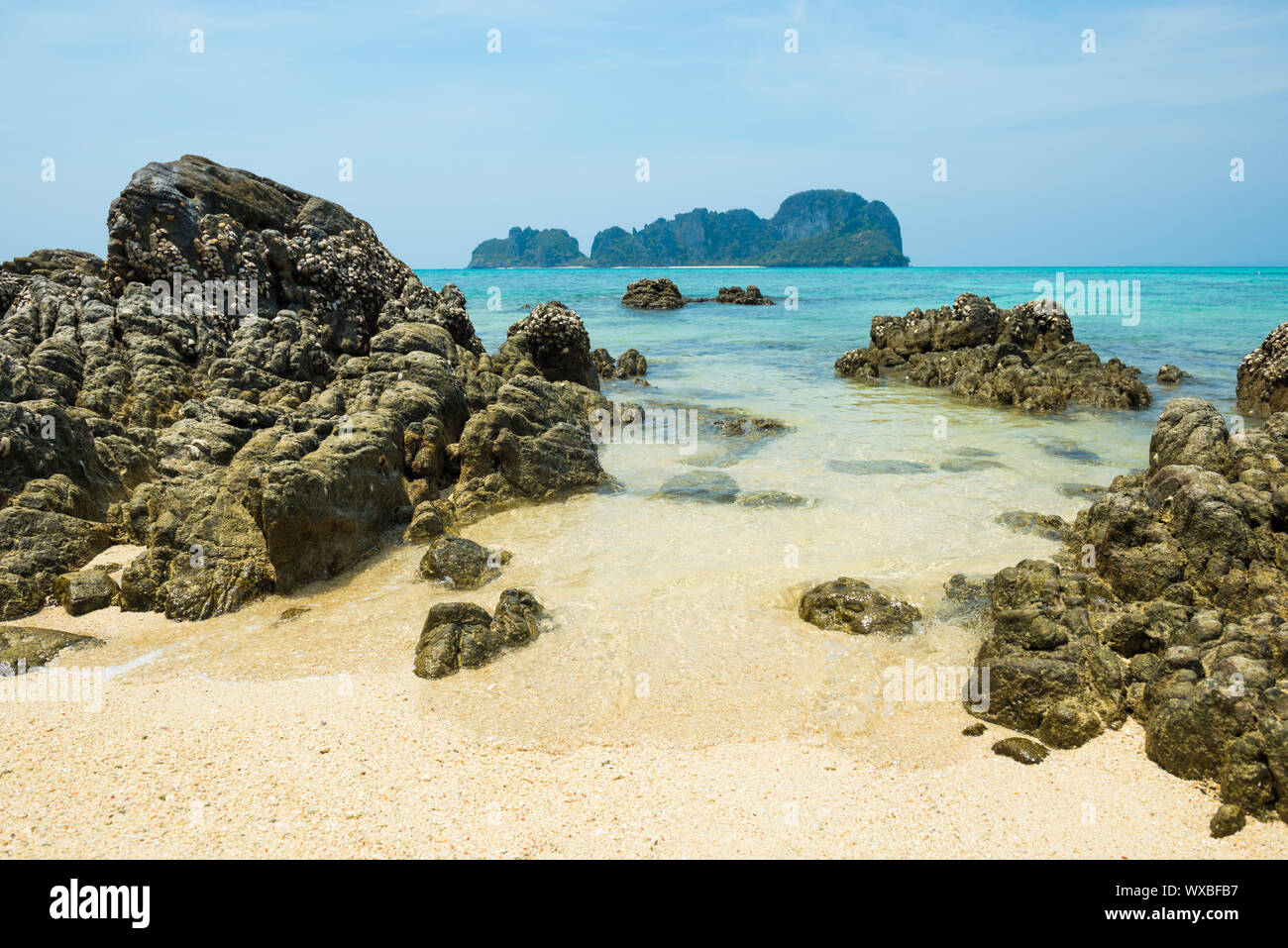 Tropical sea landscape with rocky island Stock Photo - Alamy