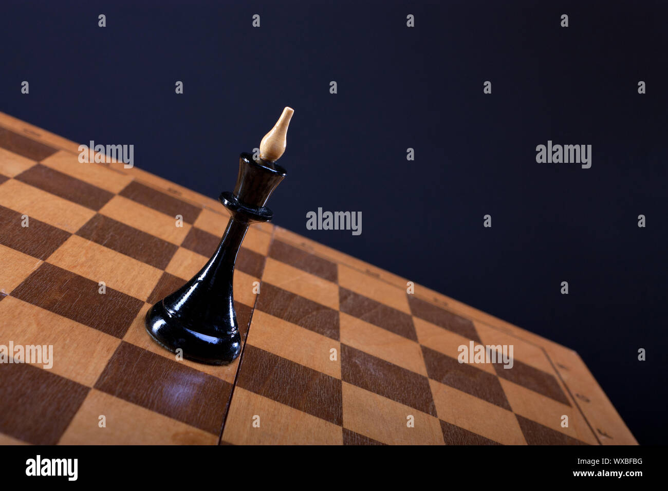 chess queen on the Board dark background Stock Photo - Alamy