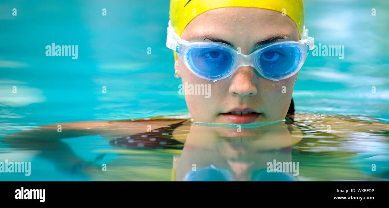 Swimmer in yellow swim cap hi-res stock photography and images - Alamy