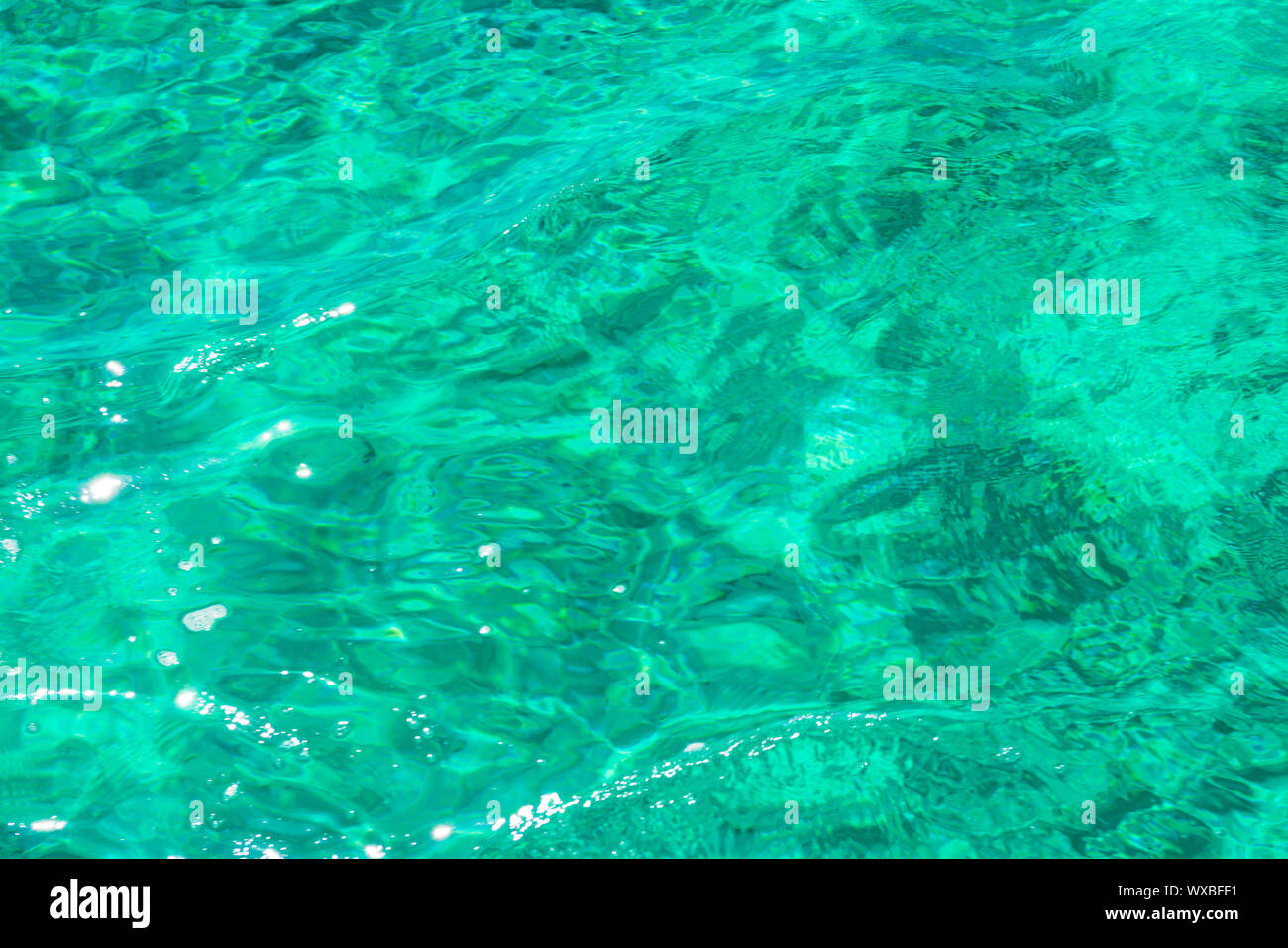 Texture of clear turquoise water surface Stock Photo - Alamy