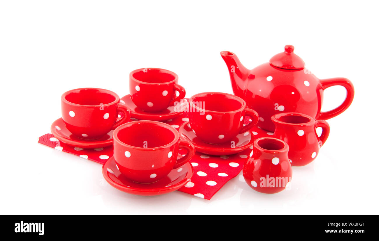 Red crockery with tea cups and pot Stock Photo - Alamy