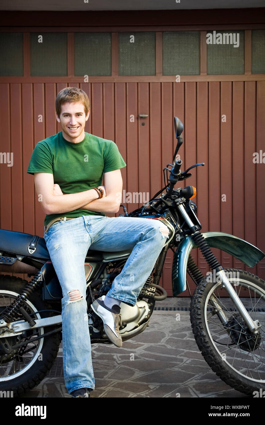 Portrait man leaning on motorcycle hi-res stock photography and images ...
