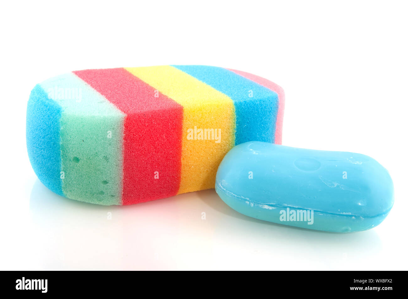 Bar of soap and colorful bath sponge Stock Photo - Alamy