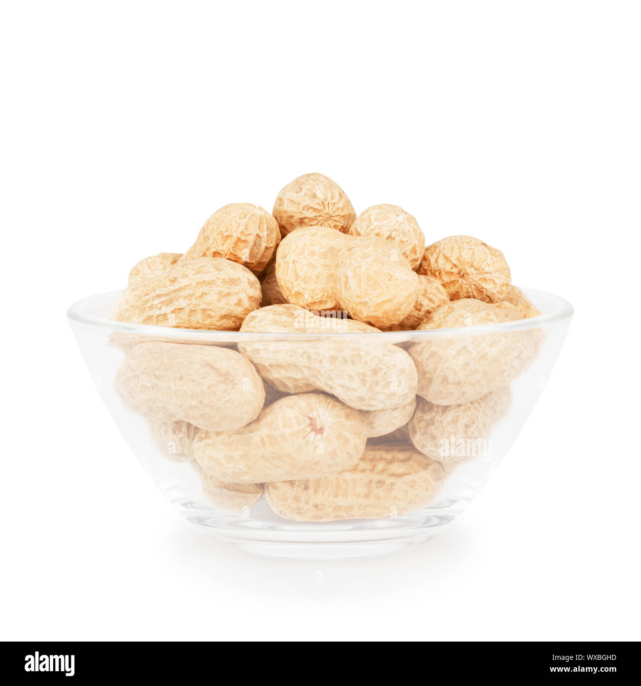 Glass bowl with peanuts in the shell isolated on white background Stock ...