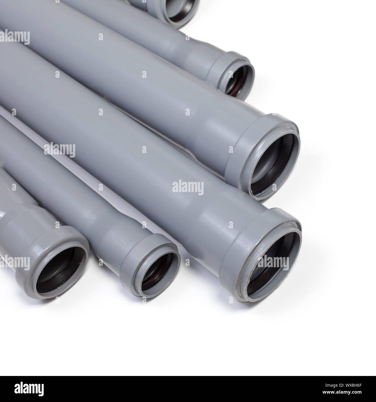 Grey PVC sewer pipes on white background Stock Photo - Alamy