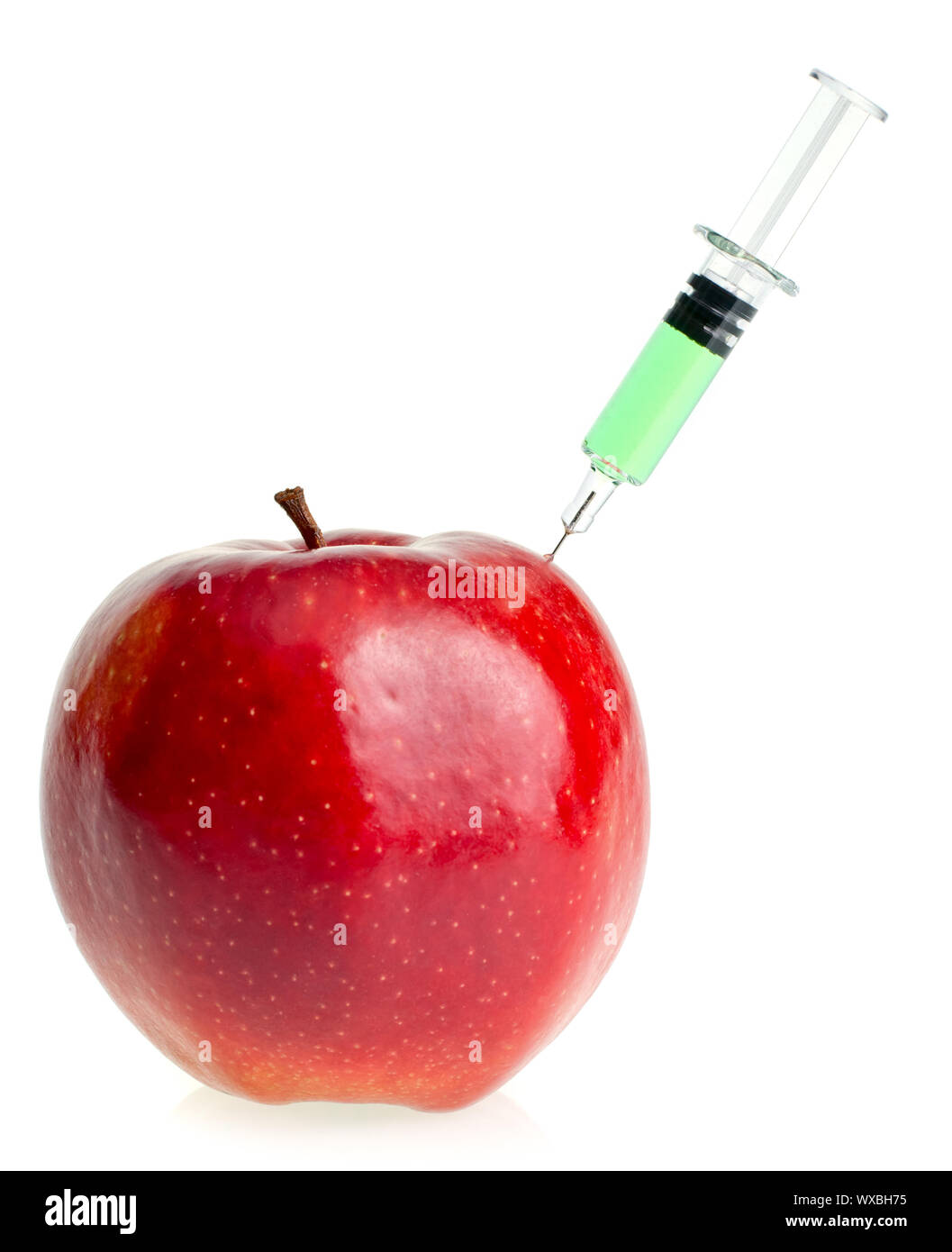 Genetic modification concept with red apple receiving an injection ...