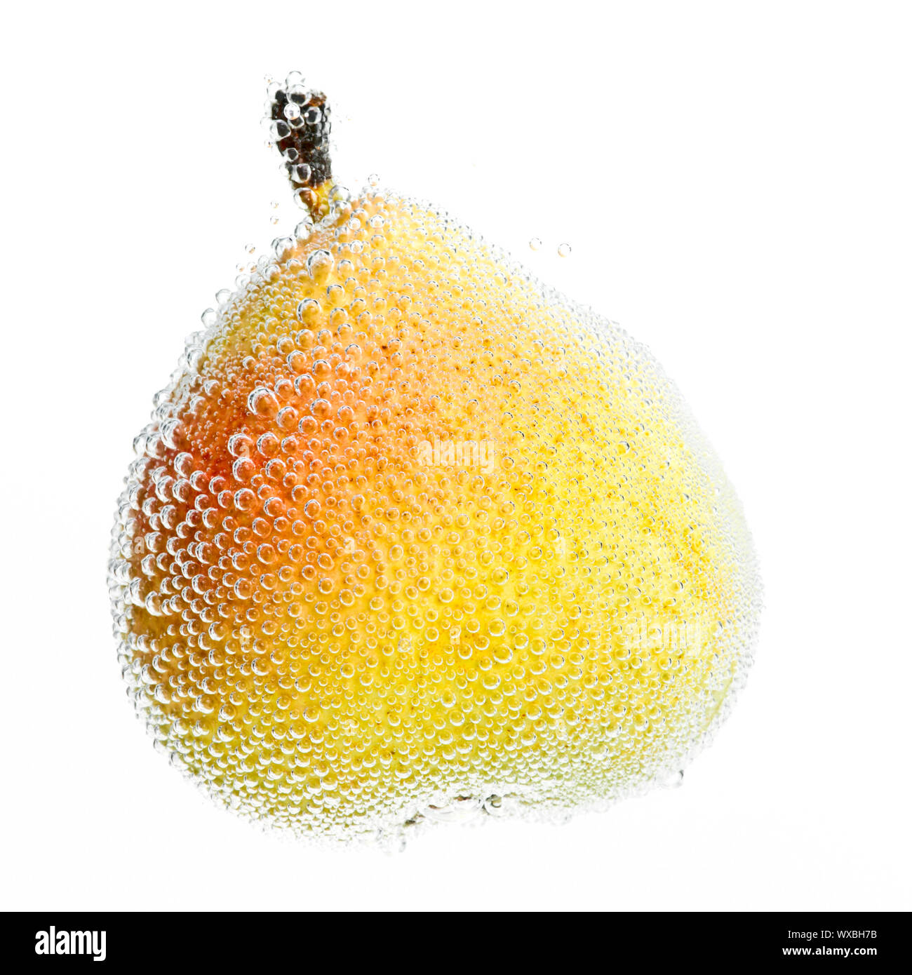 Single pear in water with bubbles on white background Stock Photo - Alamy
