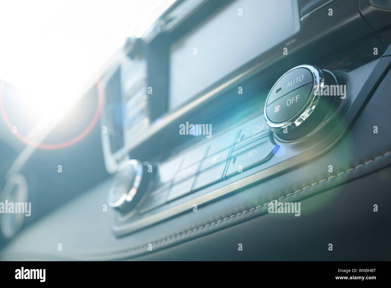 Vehicle dashboard closeup with sun flare - multimedia touch screen and ...