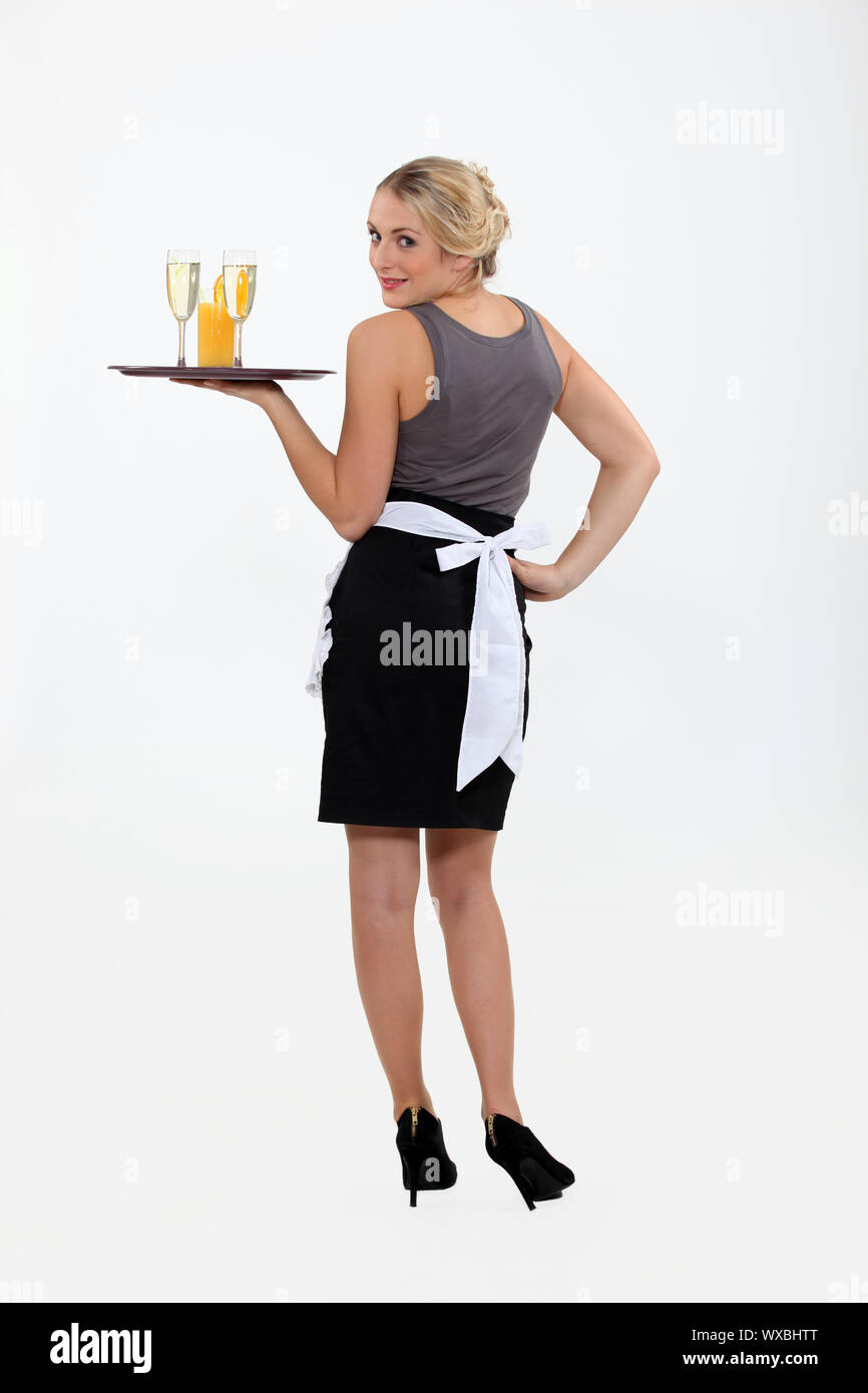 Waitress with a tray of drinks Stock Photo - Alamy