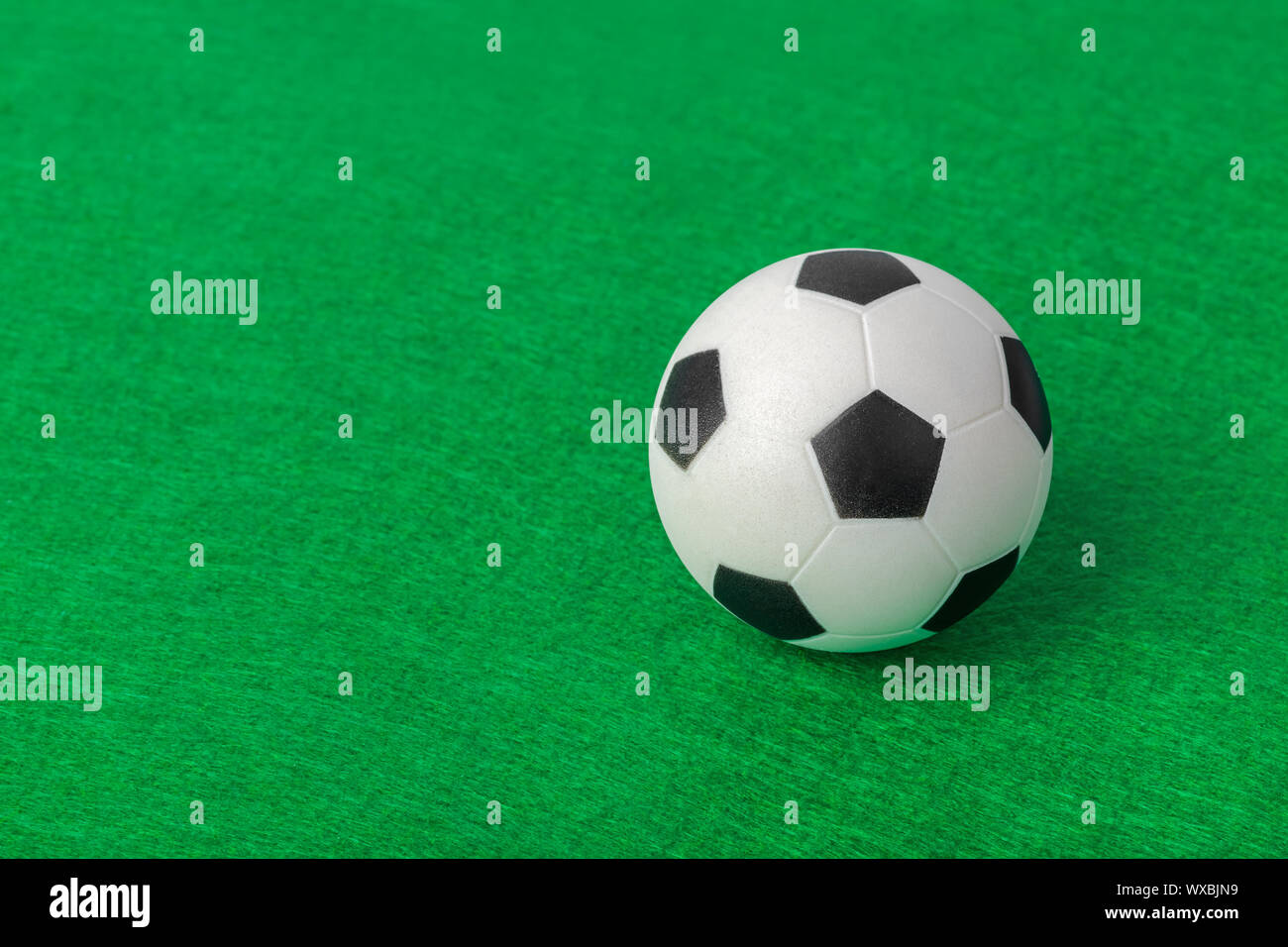 Soccer ball on football field Stock Photo - Alamy