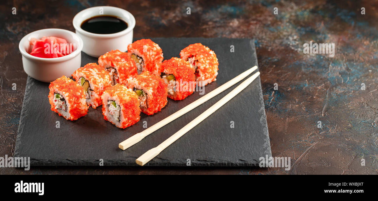 Japanese sushi on a rustic dark background Stock Photo - Alamy