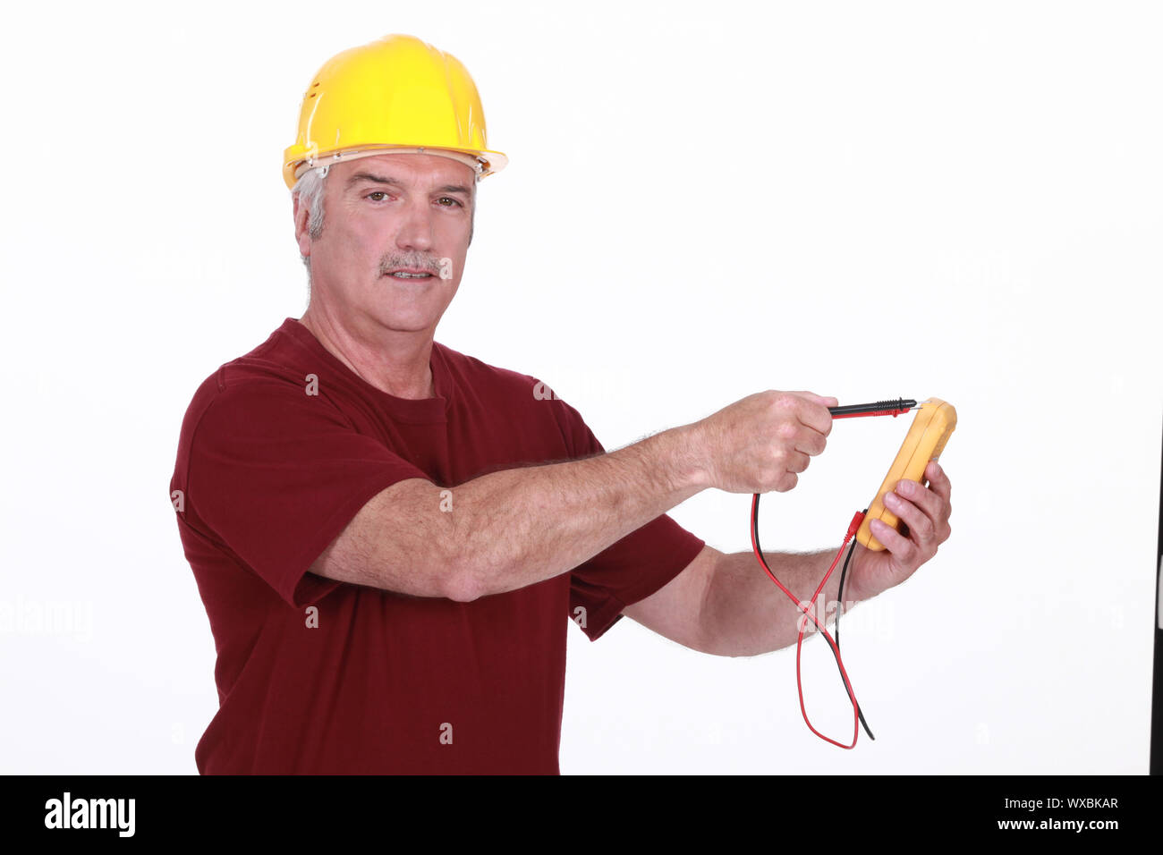 Man with a multimeter Stock Photo - Alamy