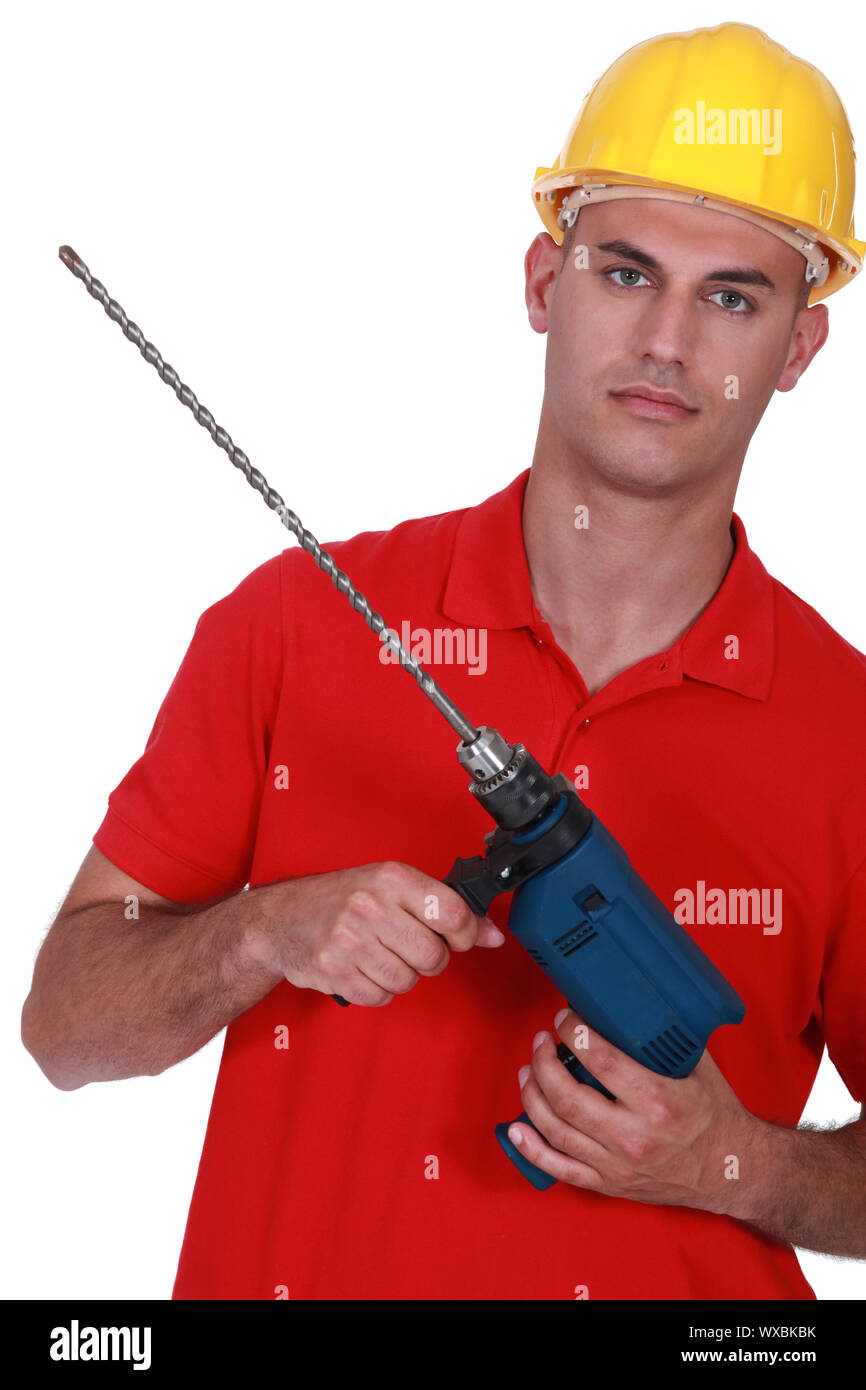 Man holding powerdrill with long bit Stock Photo - Alamy