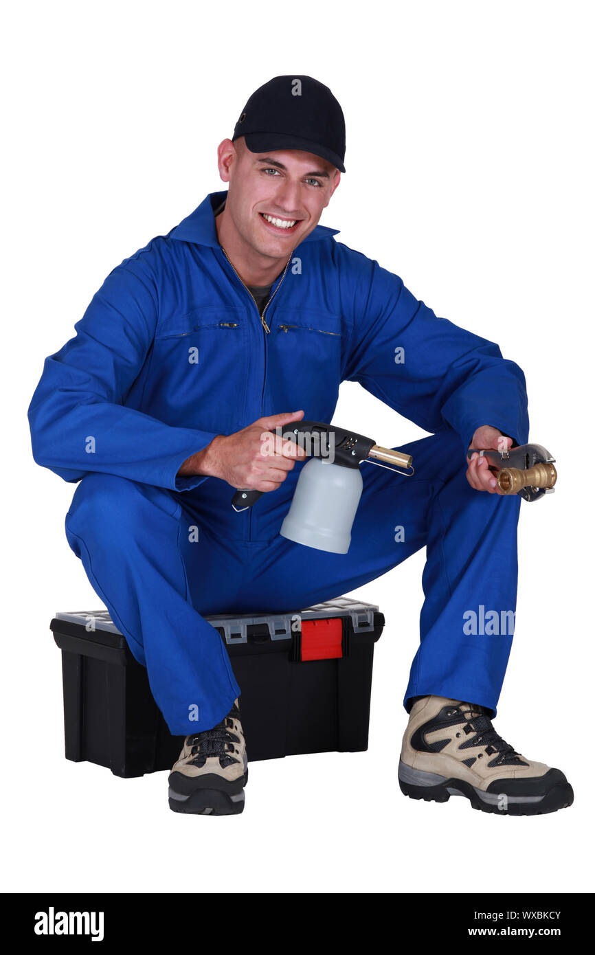 Man sitting on toolbox hi-res stock photography and images - Alamy