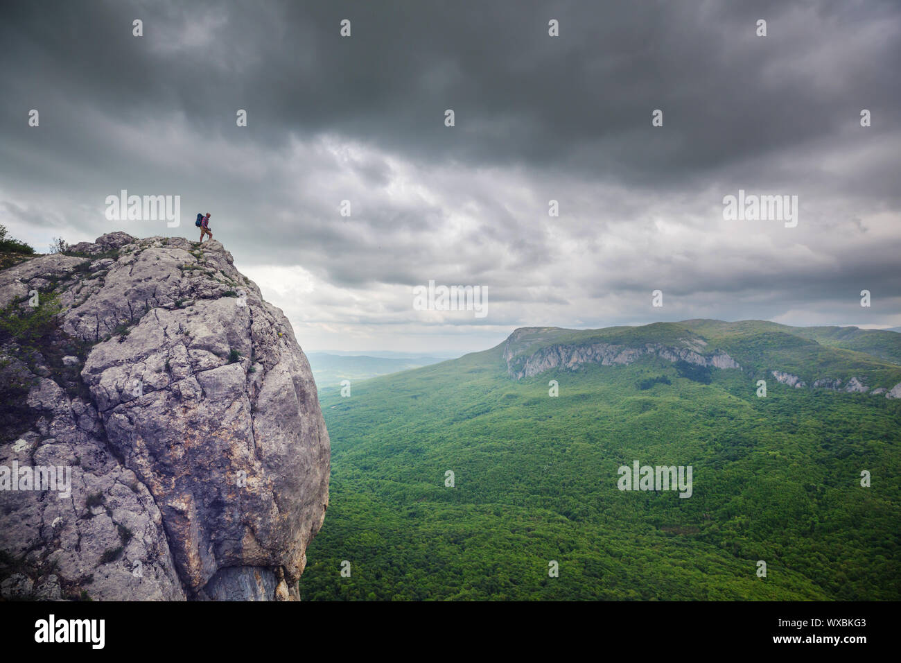 Man on the cliff Stock Photo - Alamy
