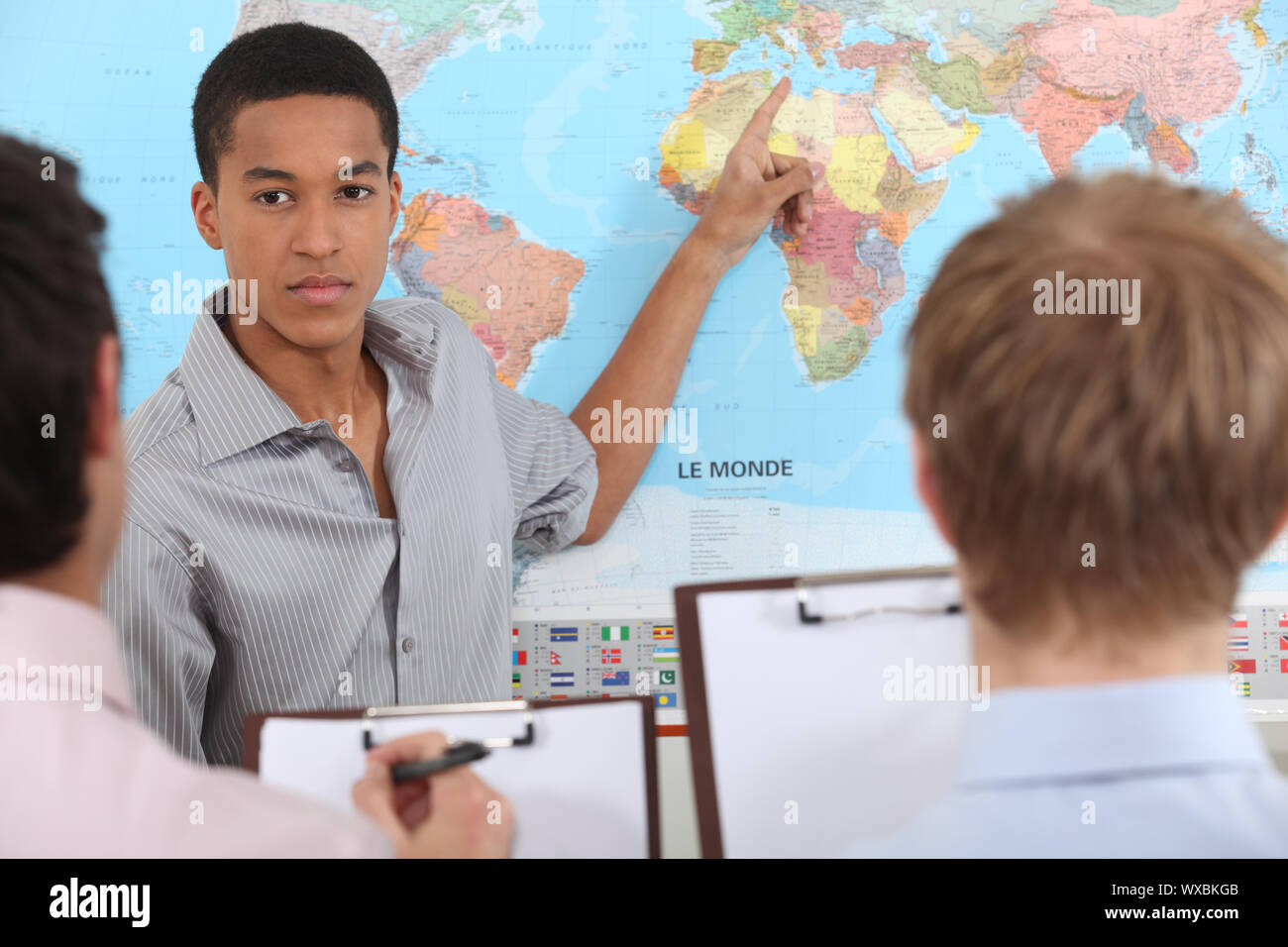 Young man giving a business presentation Stock Photo - Alamy