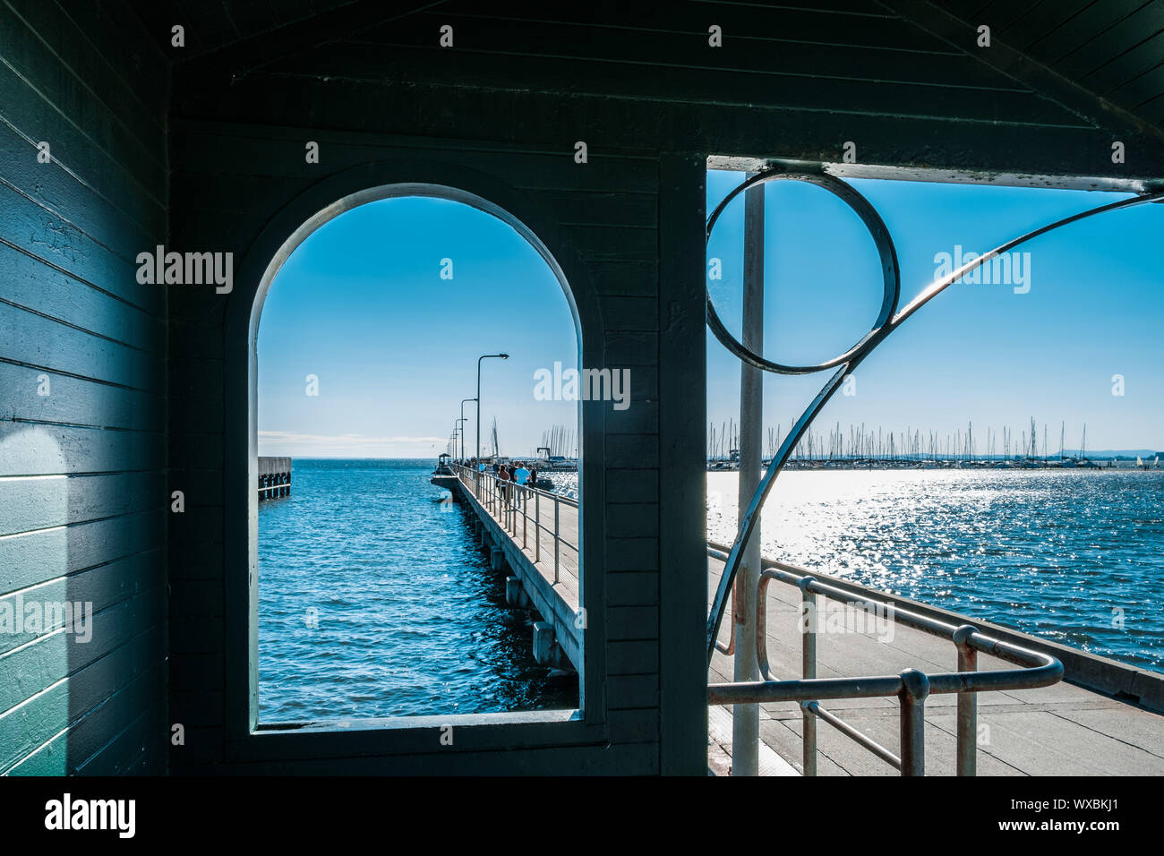 View of pier and marina through a window in bright sunlight in ...