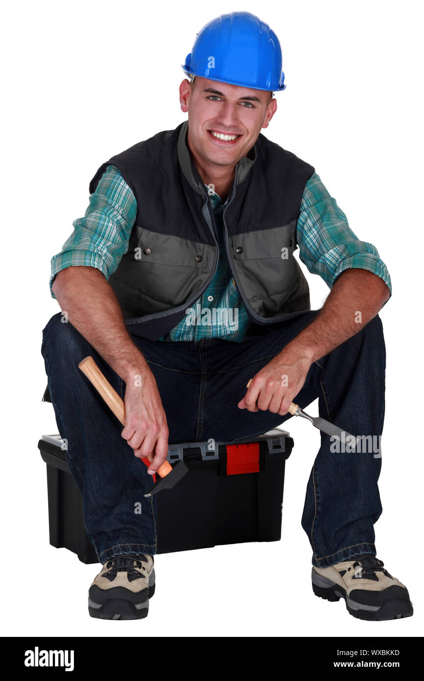 Working sat on tool box Stock Photo - Alamy