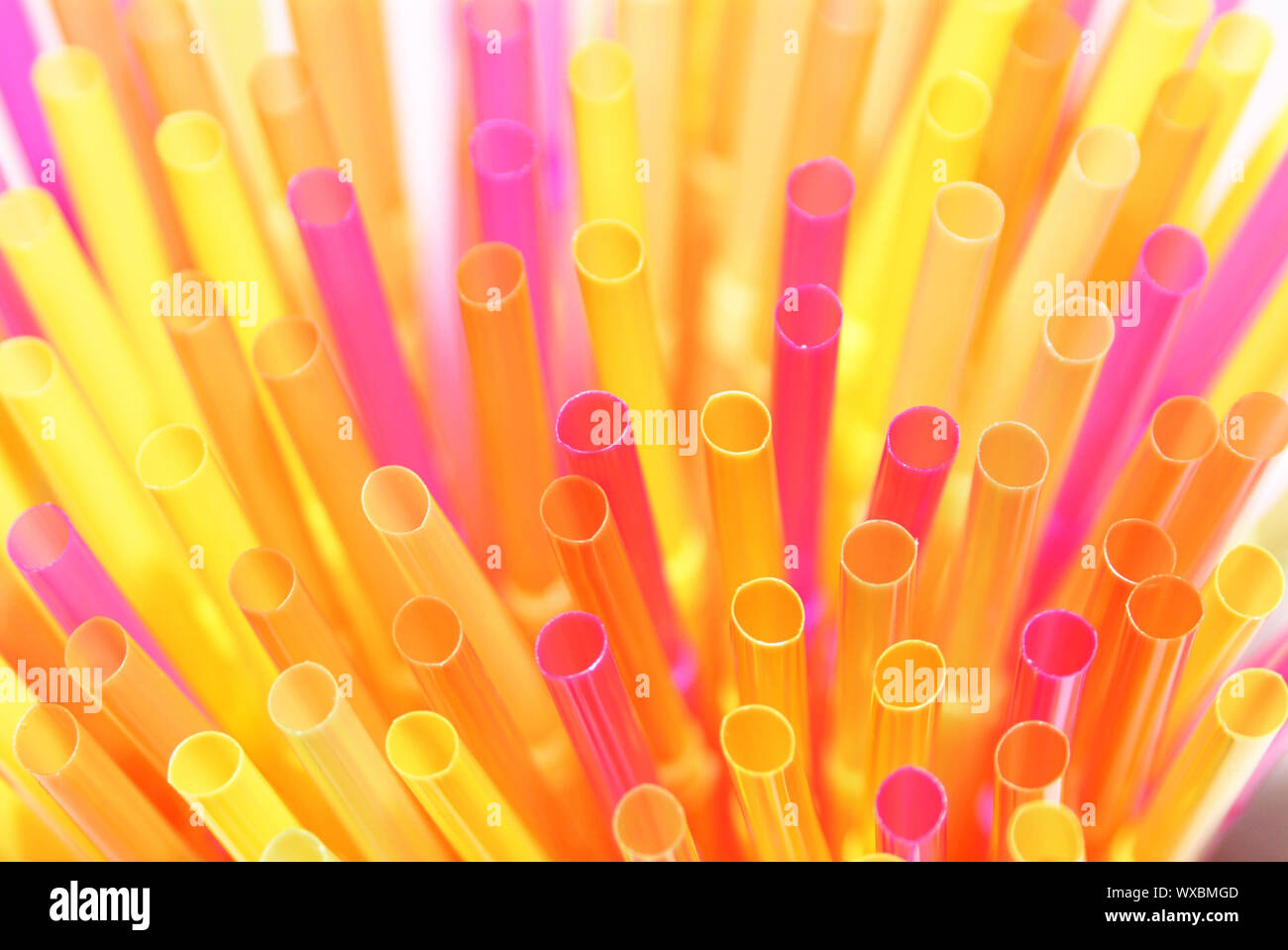 some plastic straws in different colours colors Stock Photo - Alamy