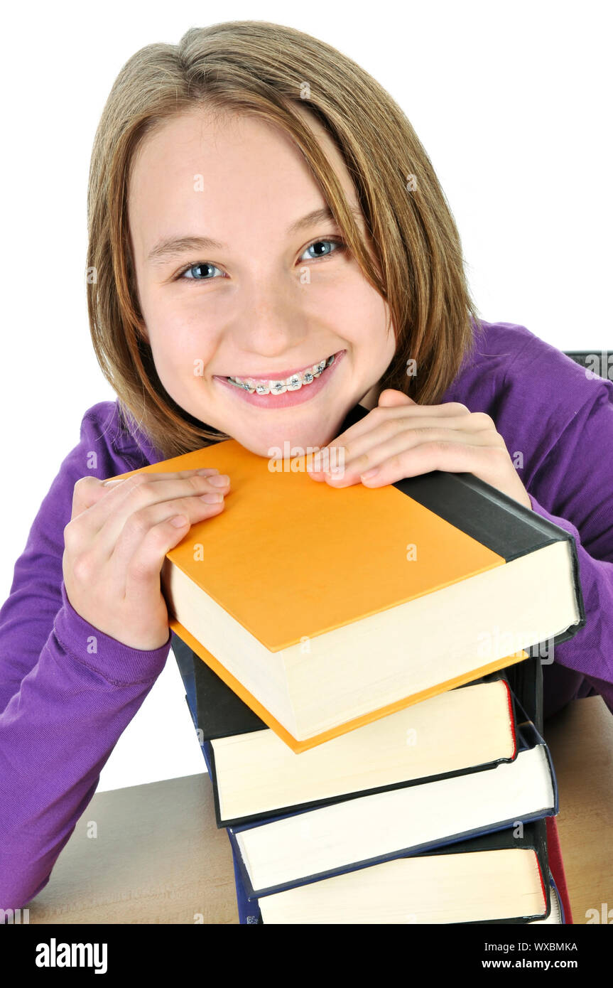 Happy teenage girl studying at the desk Stock Photo - Alamy