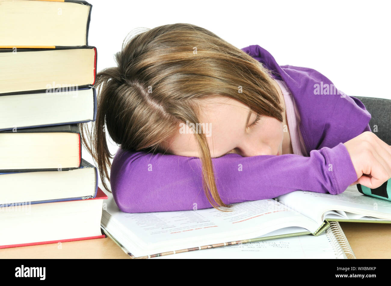 Teenage girl studying at the desk being tired Stock Photo - Alamy