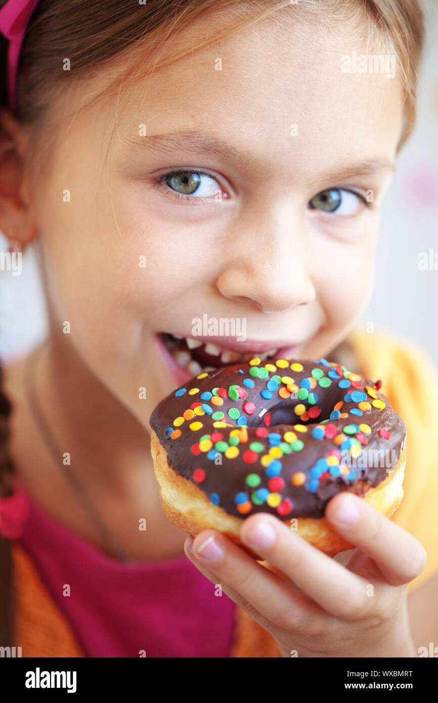 Fat kid eating sweets hi-res stock photography and images - Alamy