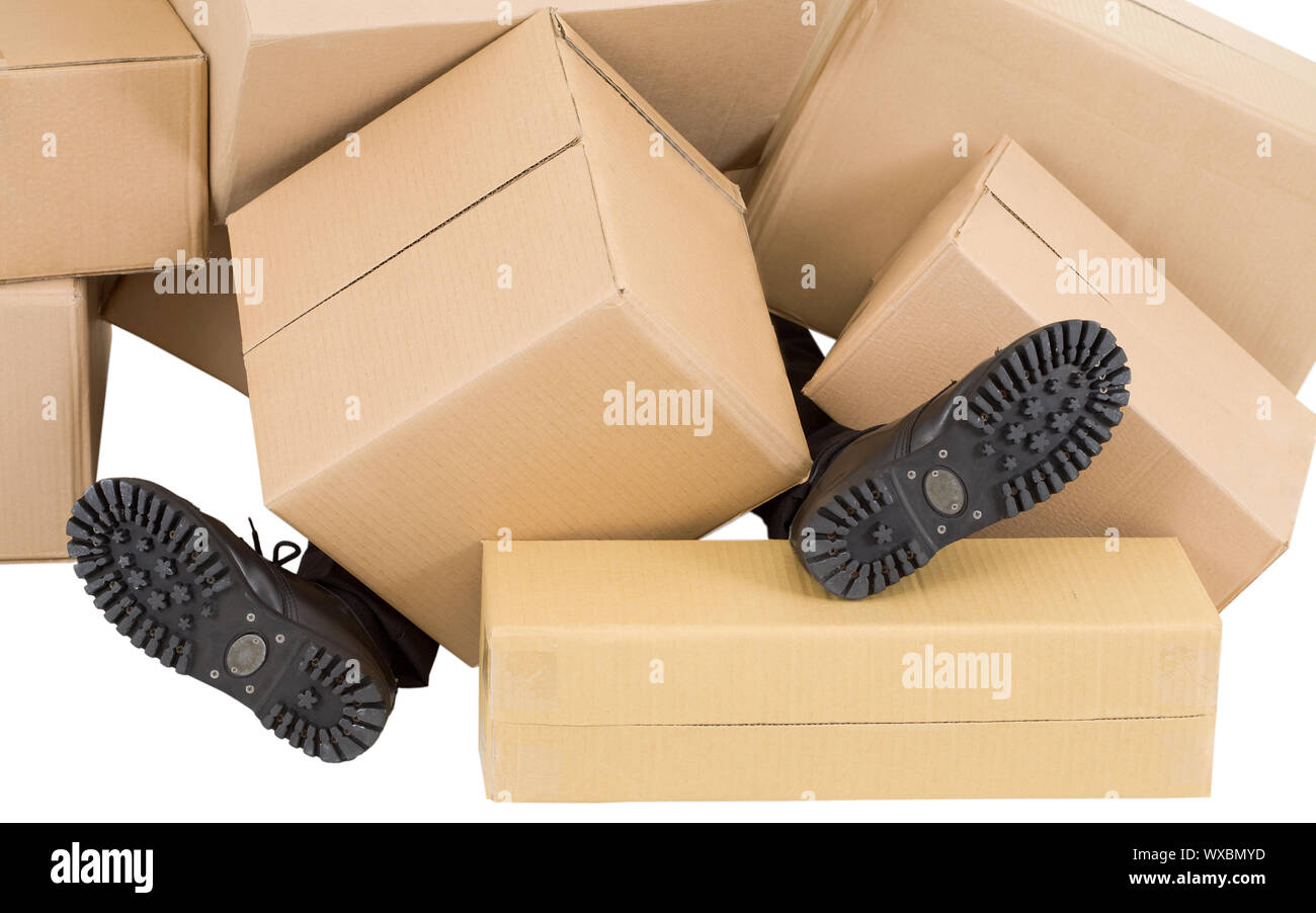 Male feet sticking out from under heaps of boxes Stock Photo - Alamy