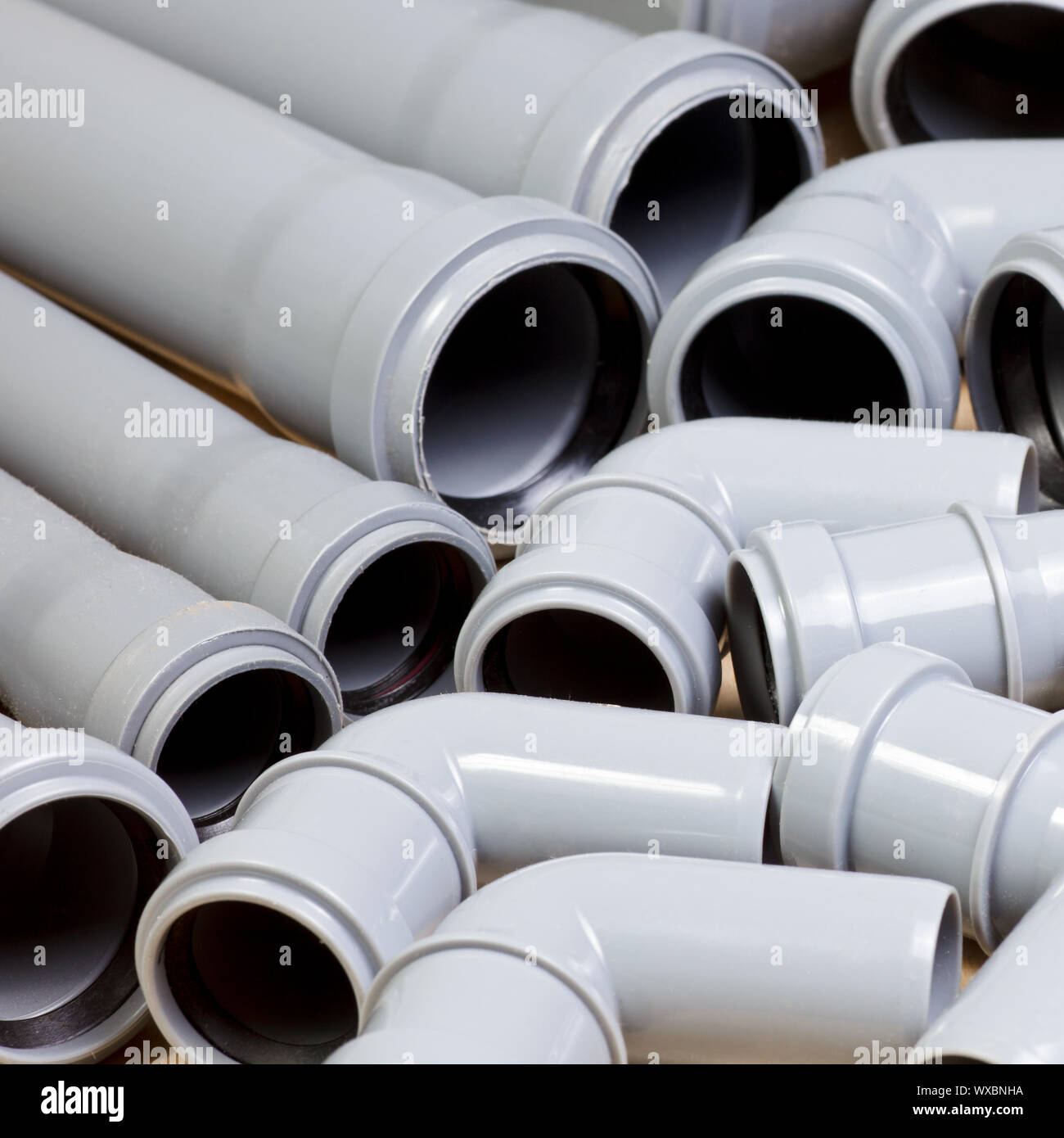 Grey PVC sewer pipes background Stock Photo - Alamy