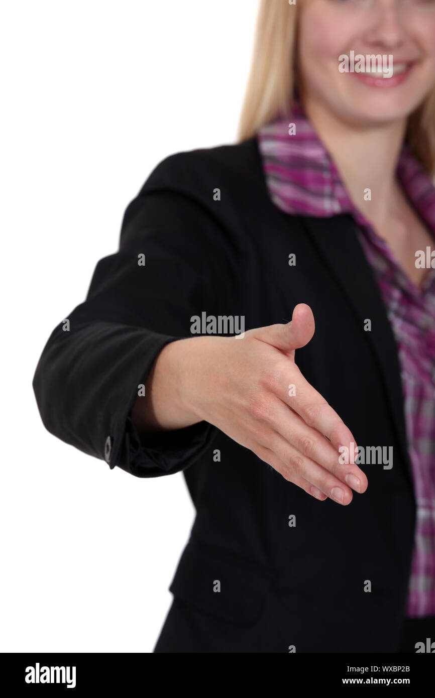 Woman holding her hand out for a handshake Stock Photo - Alamy