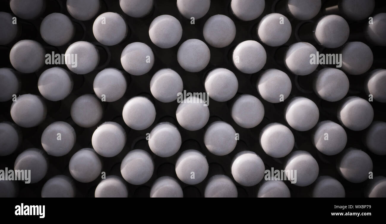 abstract texture of rods with white circle heads texture with vignette ...