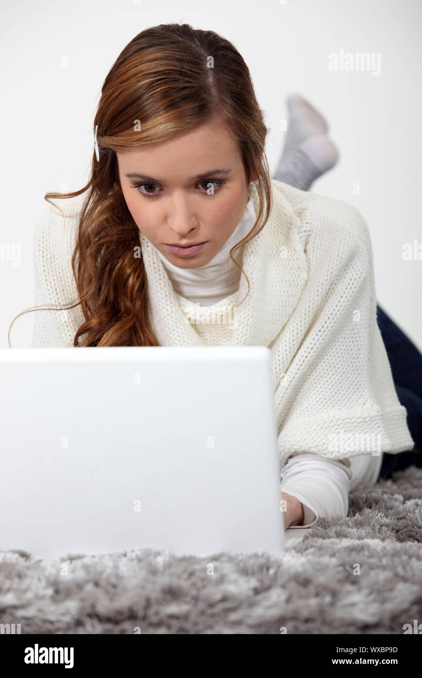 Young woman concentrating on her work Stock Photo - Alamy