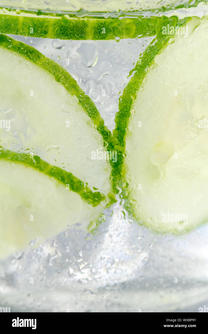 Infused water with cucumber and ice Stock Photo - Alamy