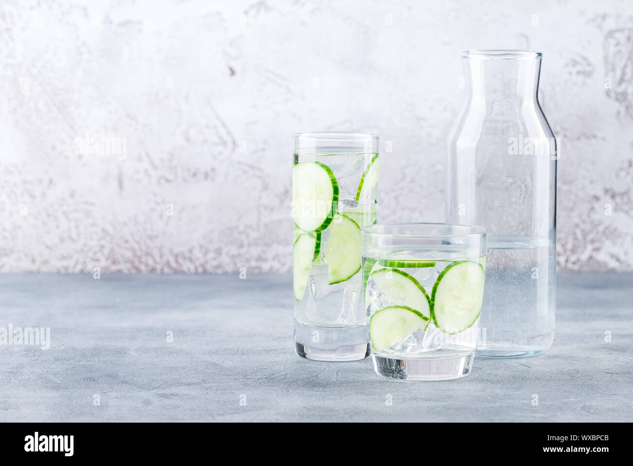 Infused water with cucumber and ice Stock Photo - Alamy