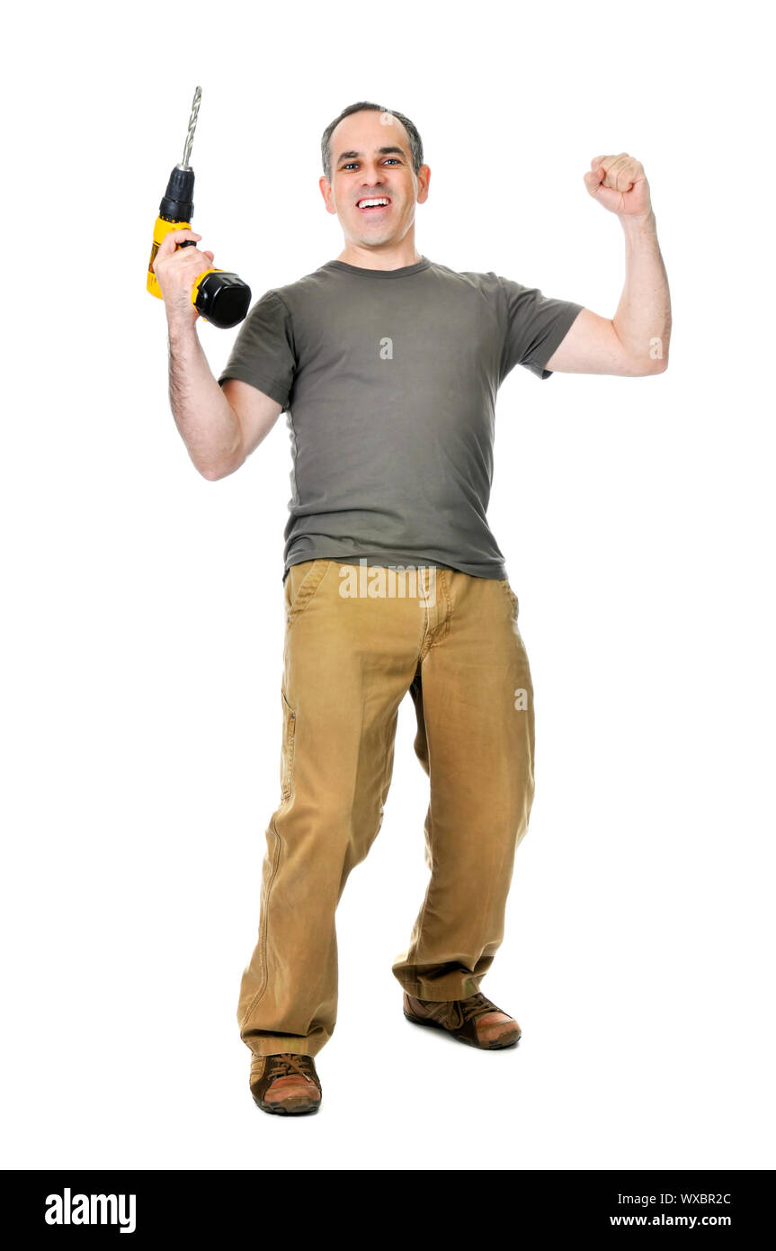Happy handyman raising his drill in victory Stock Photo - Alamy