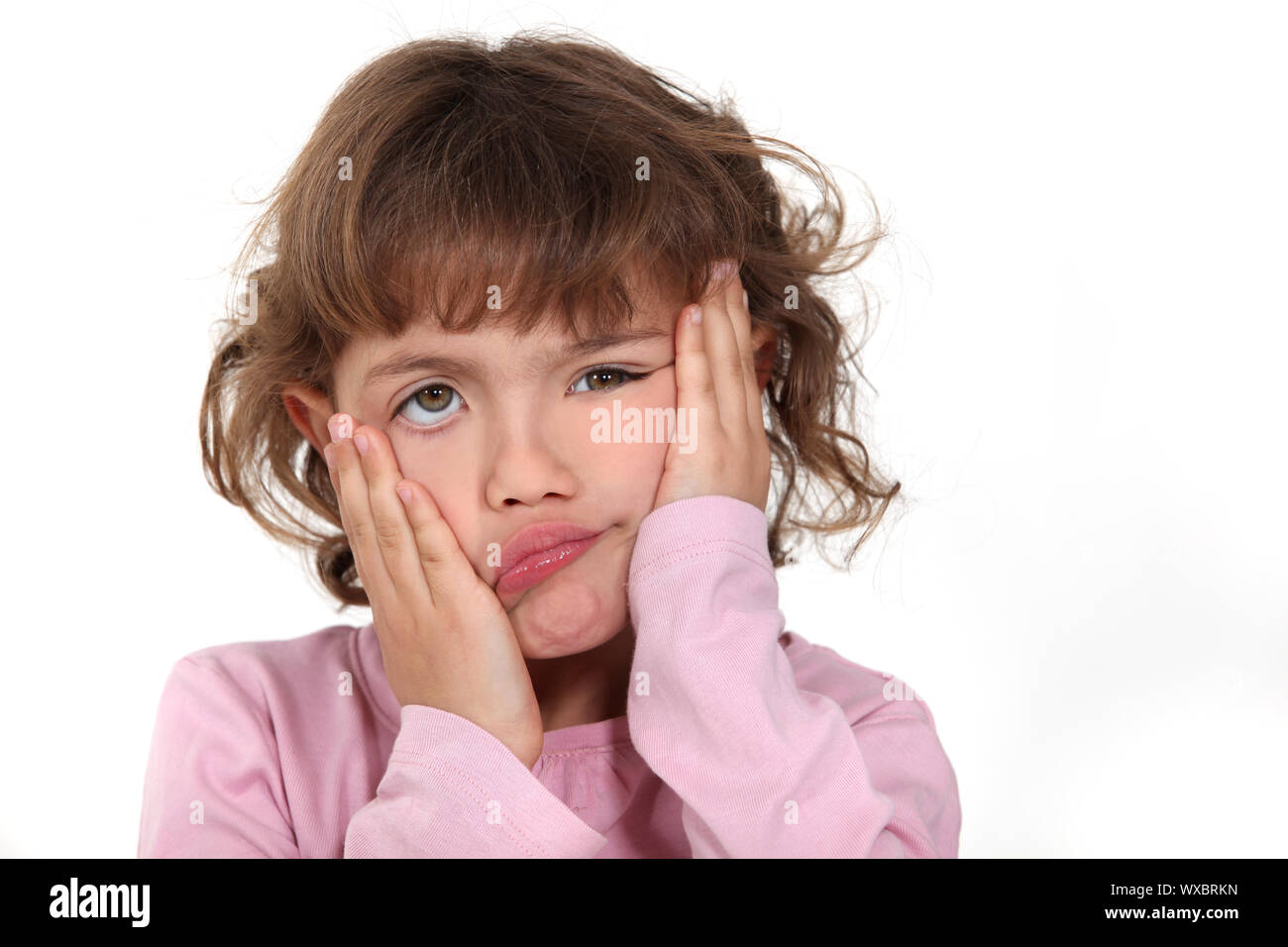 Little girl grimacing Stock Photo - Alamy