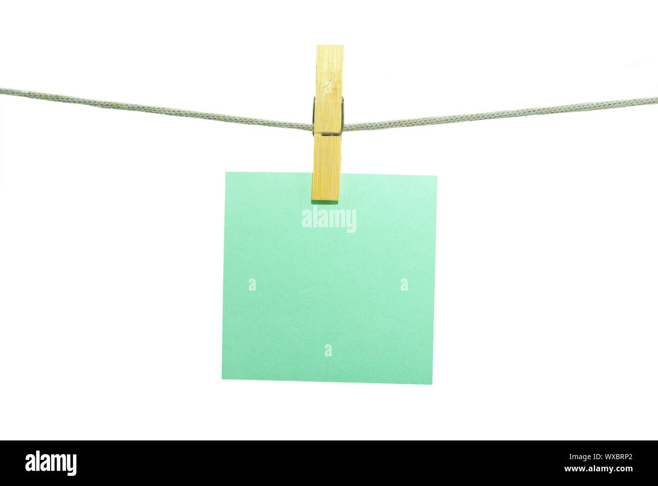 note paper blanks on rope isolated on white Stock Photo - Alamy